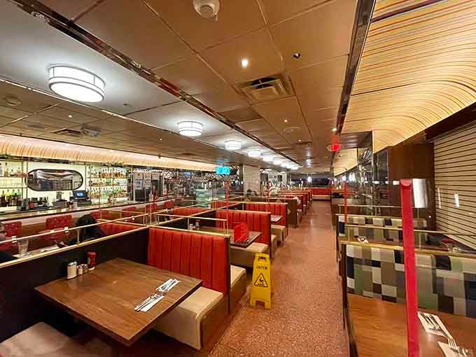 Red booths stretching into the distance like a delicious highway to breakfast bliss, any time of day.