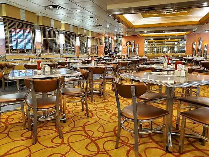 This is what diner dreams look like: endless tables, warm lighting, and carpet that's seen everything.