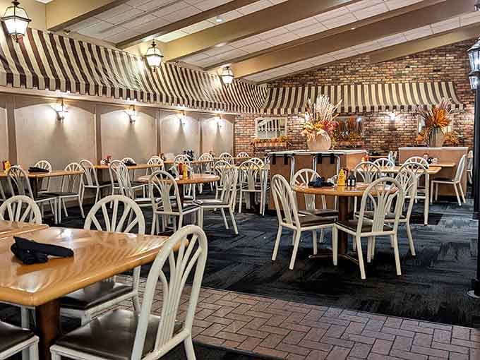 The dining room whispers "stay awhile" with its warm brick and comfortable seating arrangements.