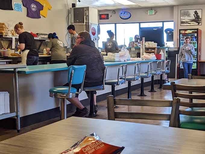 Classic diner-style seating and a friendly counter setup prove that sometimes the best meals happen in the simplest spaces.