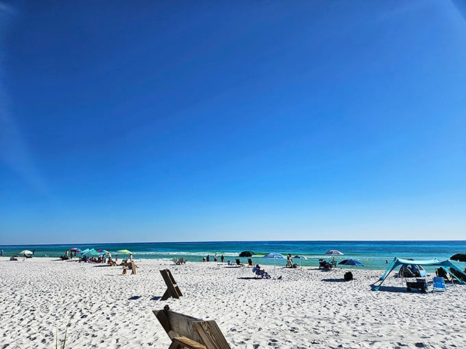 When the beach looks this good, even the wooden signs want to stick around for the view.