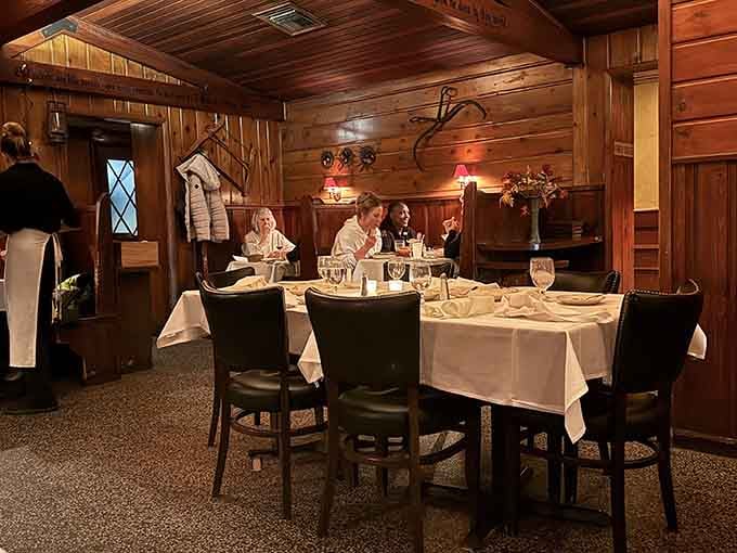 Wood paneling and white tablecloths create the kind of atmosphere where conversations linger and nobody checks their phone.