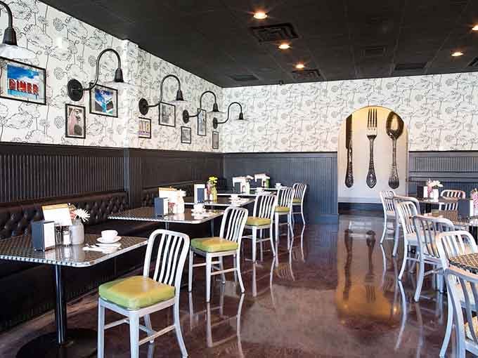 Modern meets cozy with those oversized utensils on the wall reminding you this place takes food seriously, but not itself.