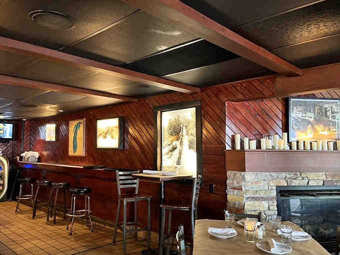 Wood paneling and warm lighting create a cozy cabin atmosphere that welcomes you like an old friend.