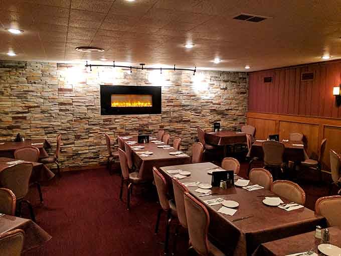 Stone fireplace, cozy booths, and warm lighting create the perfect setting for a steak dinner worth remembering.