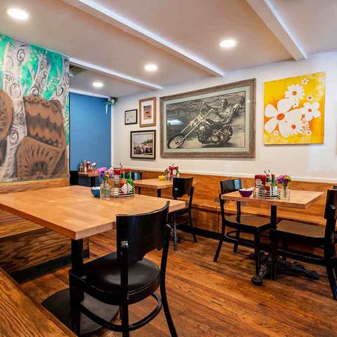 Cozy wooden tables and eclectic art create the perfect backdrop for serious breakfast business and even more serious potato consumption.