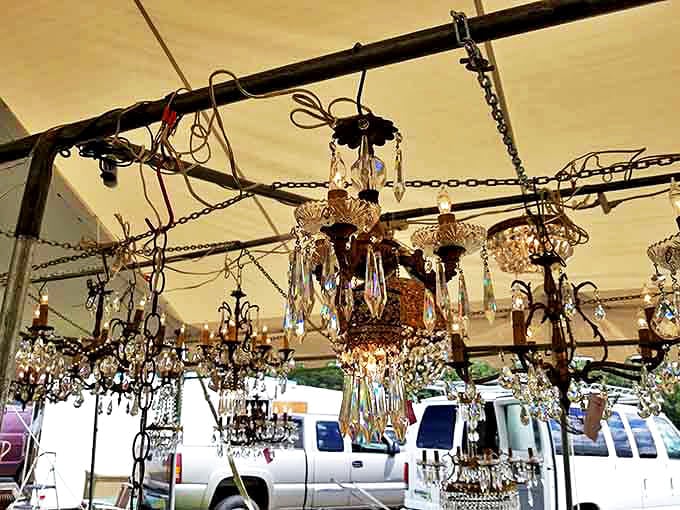 Crystal chandeliers hanging like glittering stalactites in a cave of vintage opulence. Downton Abbey, eat your heart out!