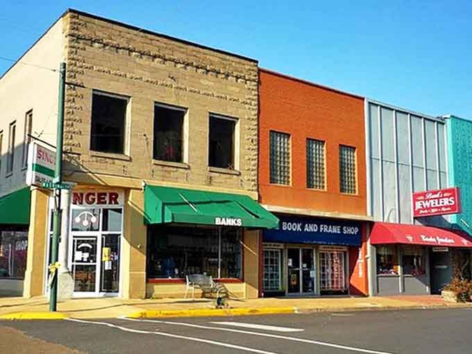 Banks Book and Frame Shop stands proudly among a rainbow of awnings, proving independent businesses still thrive in small-town America.