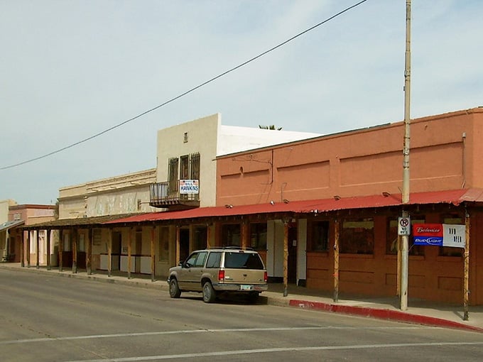 These weathered storefronts have witnessed over a century of Arizona history. The wooden awnings still offer blessed shade to modern-day visitors.