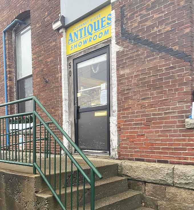 The unassuming entrance belies what awaits inside&mdash;like finding Narnia through a brick wardrobe. Yellow sign promises, brick exterior keeps secrets.