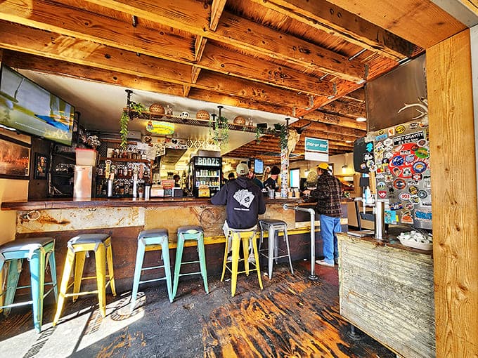 Inside, rustic wooden beams and colorful stools create the perfect backdrop for burrito magic. Like a mountain cabin that happens to serve life-changing breakfast.