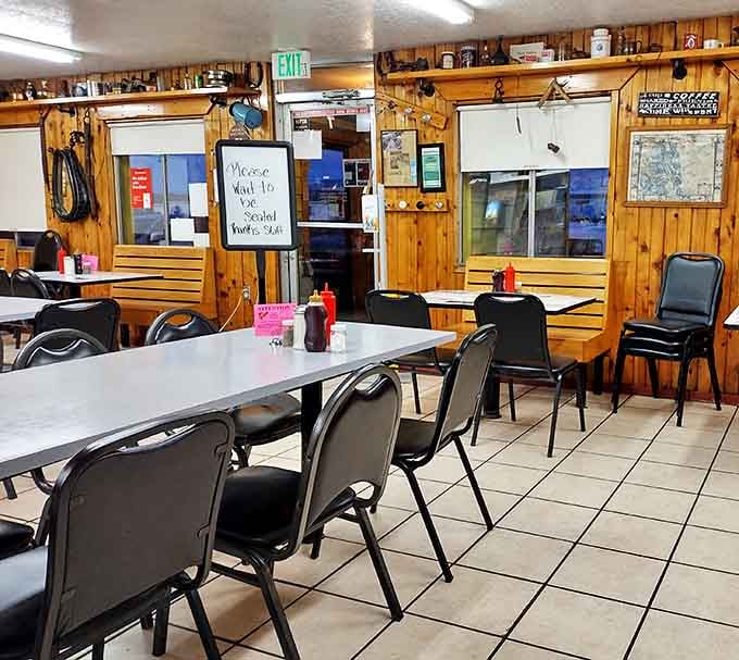 Wood-paneled walls and no-nonsense seating create that perfect "come as you are" diner atmosphere where comfort trumps pretension every time.