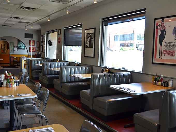 Classic blue vinyl booths and vintage movie posters create that perfect time-capsule deli atmosphere where comfort begins before you even order.