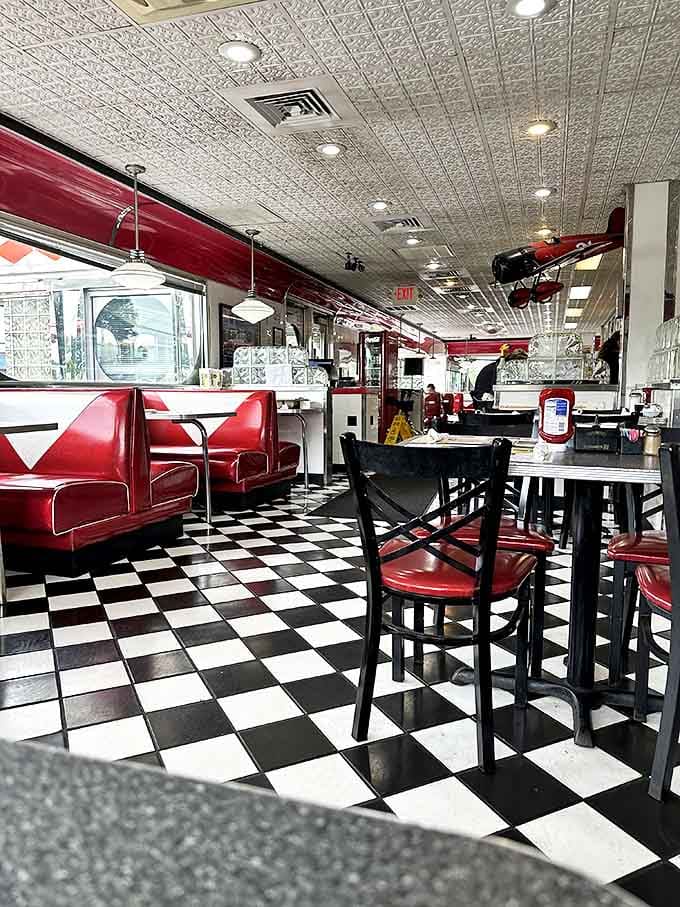 Step inside and the checkerboard floor plays optical illusions with your hunger. Those red vinyl booths aren't just seating&mdash;they're front-row tickets to breakfast theater.