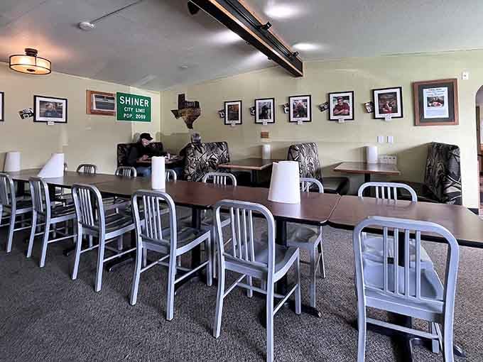 Inside, Texas pride meets Pacific Northwest practicality with simple metal chairs, wooden tables, and that essential Shiner Beer sign watching over it all.