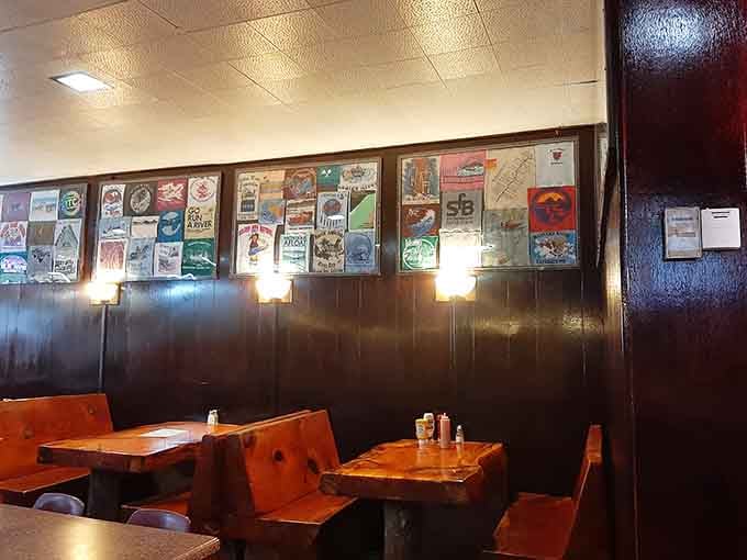 Dark wood paneling and decades of memorabilia create the perfect backdrop for serious burger business. History you can touch while you eat.