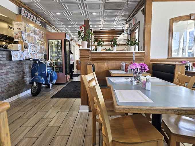 Step inside and be greeted by that blue Vespa &ndash; a charming Mediterranean wink that says, "You're not in an ordinary diner anymore."