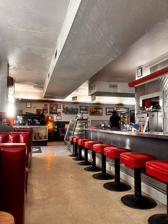 The counter where strangers become friends and diet plans go to die, one bottomless coffee at a time.