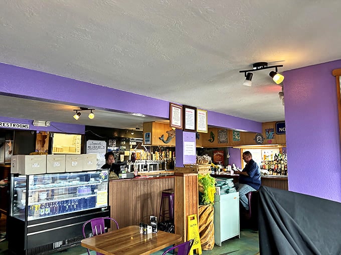 Purple walls and wooden accents create that perfect "come as you are" Alaskan vibe where conversations flow as freely as the local brews.