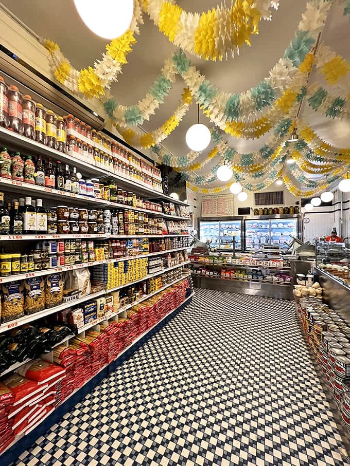 Step inside and the ceiling's festive streamers announce what your stomach already knows: you've entered a perpetual celebration of all things deliciously Italian.
