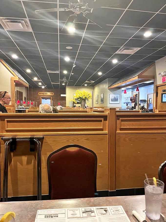 Wooden booths polished by decades of elbows create that perfect diner ambiance&mdash;where conversations flow as freely as the coffee refills.