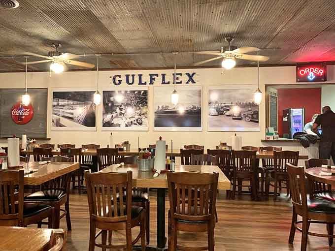 History hangs on the walls at Hoot's, where vintage Gulflex photos and corrugated tin ceilings tell stories while you create new ones over brisket.