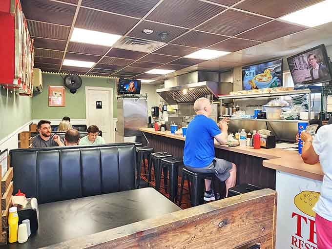 The counter seating at Ted's isn't just functional &ndash; it's front-row tickets to a steamed burger symphony where every sizzle tells a story.