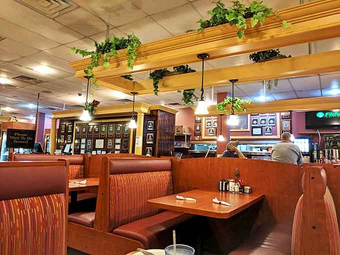 Wooden booths with that perfect worn-in comfort, hanging plants, and warm lighting&mdash;this isn't just a meal, it's a homecoming.