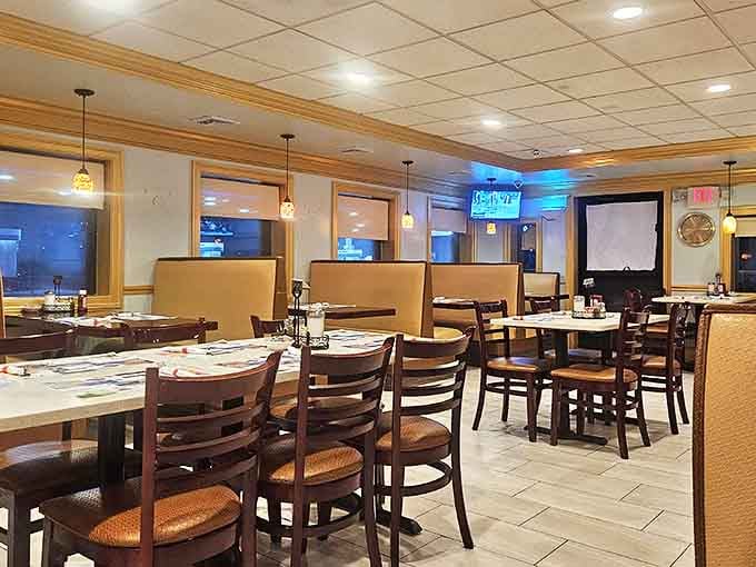 Classic diner aesthetics meet modern comfort with warm pendant lighting, comfortable booths, and that unmistakable buzz of contentment that follows good food.