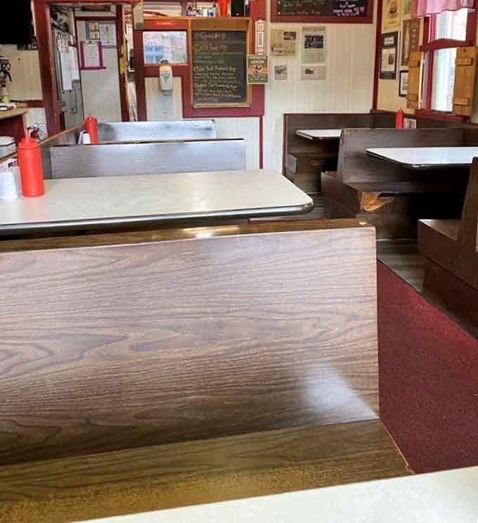 Classic diner booths where memories are made between bites of breakfast and sips of coffee that never stops flowing.