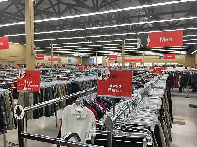 The men's section stands at attention like an army of button-downs awaiting their next mission. Each garment holds the promise of a second life.