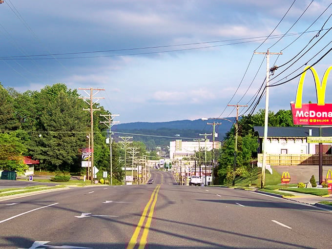 Main Street stretches toward the Blue Ridge Mountains like a postcard from simpler times, where fast food meets small-town charm under Virginia's expansive sky.