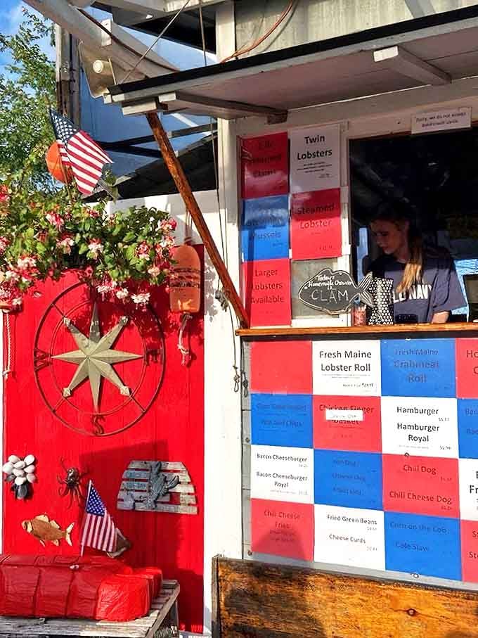 Where lobster dreams come true. The vibrant red-and-blue menu board showcases Maine's finest offerings while nautical decorations remind you exactly where your meal originated.