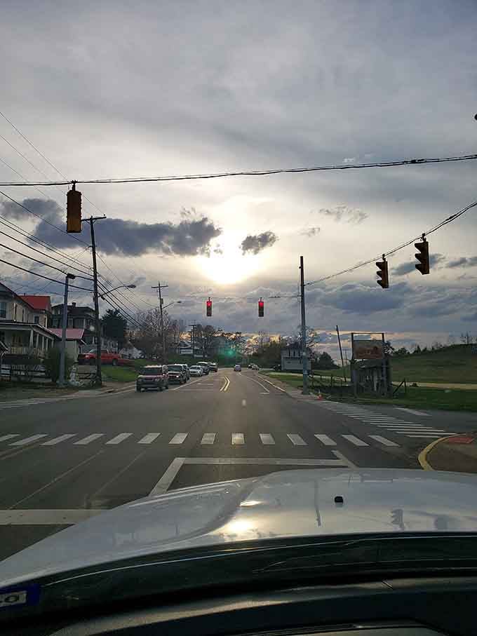 Sunset paints the sky over Ripley's streets, where traffic lights blink lazily and the pace of life follows nature's rhythm.