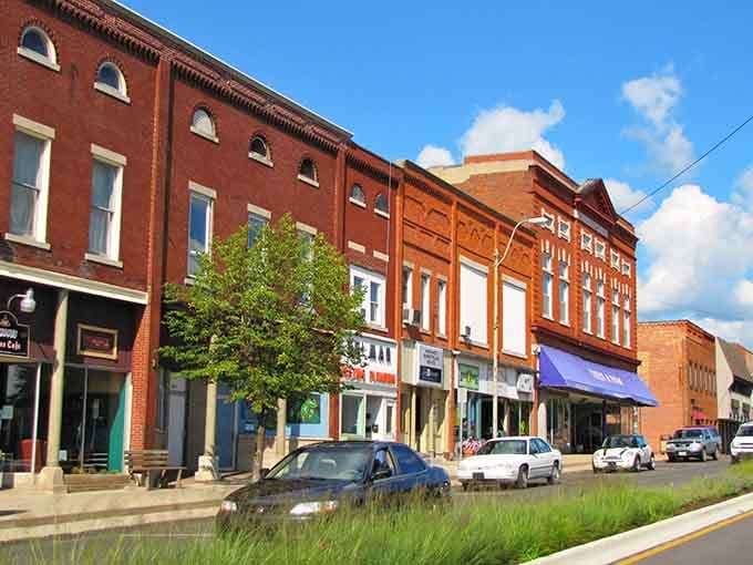 Fresh green landscaping softens the historic brick buildings, proving beauty doesn't require a trust fund to maintain.