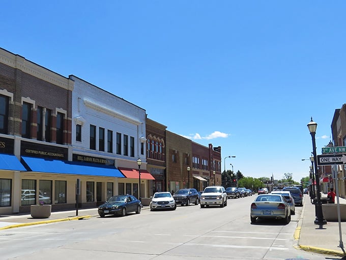Bright awnings and clean sidewalks invite leisurely strolls through a downtown that remembers when Main Street mattered most.