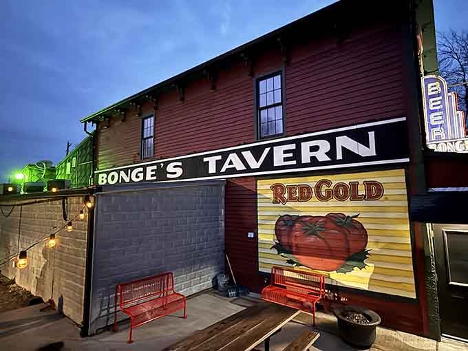 The vintage neon and rustic red siding whisper stories of countless memorable meals shared over decades.