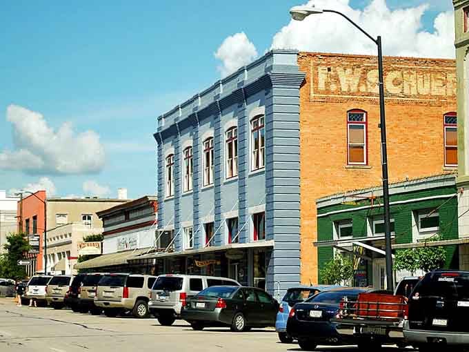 That gorgeous blue building pops like a jewel box against the sky, proving small towns do color beautifully.