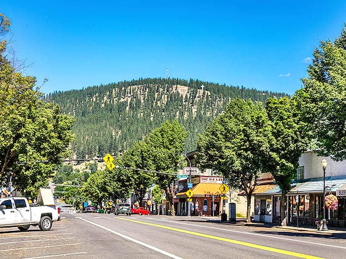 Mountains draped in evergreens create a backdrop so dramatic, the town looks like it's posing for postcards.