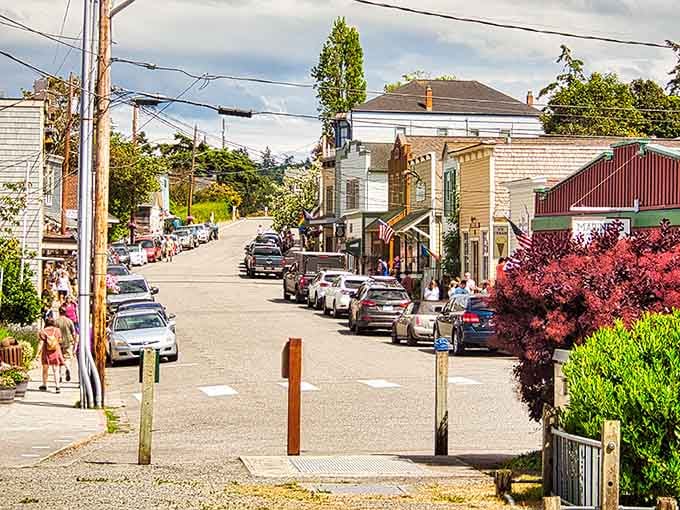 Coupeville's hillside street climbs toward the sky, where historic homes and vibrant gardens create a postcard-perfect scene.