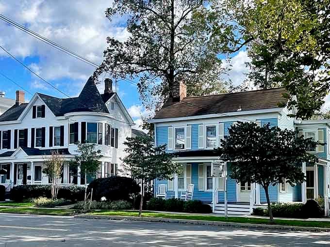 These pastel Victorian homes with their wraparound porches practically whisper stories of lazy summer afternoons and sweet tea.