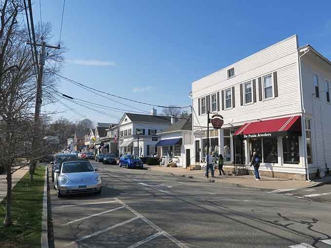 Blue skies frame white clapboard buildings in a town that's mastered the art of staying charmingly, wonderfully itself.