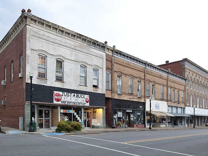 Greensboro's historic buildings whisper stories from another era, their brick facades standing sentinel over the quiet main street.