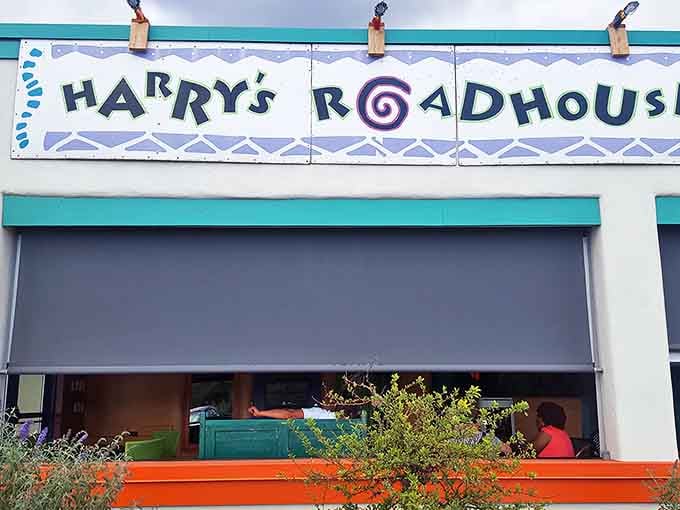 Harry's Roadhouse sign promises roadside dining with Santa Fe flair. The spiral in the logo hints at culinary adventures ahead!