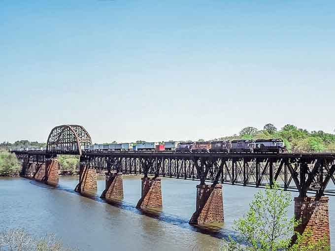 This railroad bridge stretches across the water like an iron giant taking a leisurely stroll to nowhere.