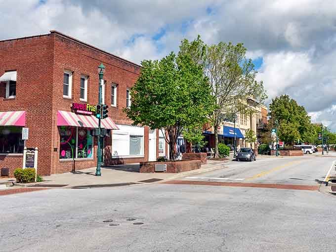 Historic brick buildings line Hendersonville's charming Main Street, where small-town magic happens at a delightfully unhurried pace.