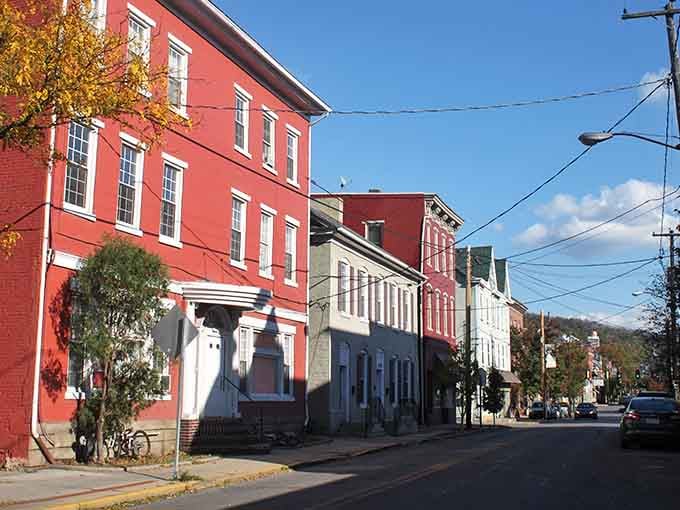 Red brick buildings stand like proud sentinels, guarding stories that span generations of community spirit.