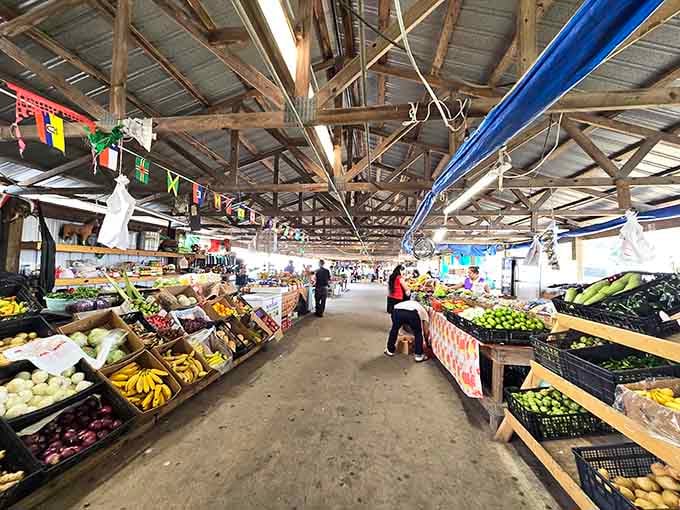 Inside, those wooden beams soar overhead while fresh bananas and bright produce create a rainbow of possibilities.
