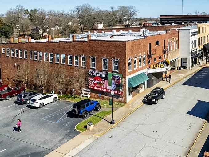 Historic brick buildings stand proud in this aerial view, showing a town that's aged like fine wine.