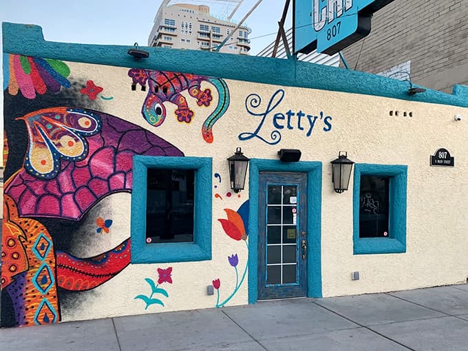 Letty's vibrant mural welcomes you like a colorful hug before the feast of Mexican flavors begins.